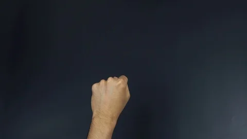 Cheering and moving fist gesture on blac... | Stock Video | Pond5