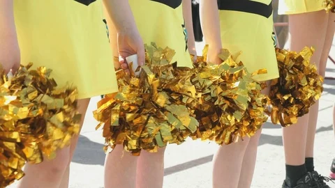 Cheerleaders girls dressed in yellow cos... | Stock Video | Pond5