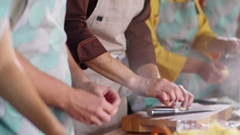 Chef and Students Smashing Garlic at Coo... | Stock Video | Pond5