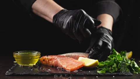 The chef marinates red fish steaks on a ... | Stock Video | Pond5