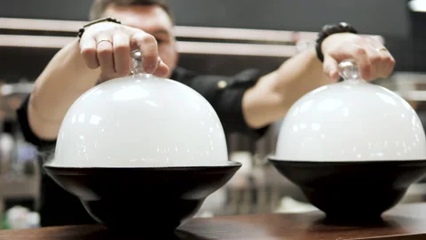 the chef opens a glass dome from which f... | Stock Video | Pond5
