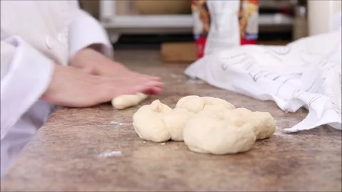 Chef rolling and shaping fresh bread dou... | Stock Video | Pond5