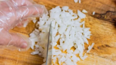 Chef showing how to cut onion into cubes | Stock Video | Pond5