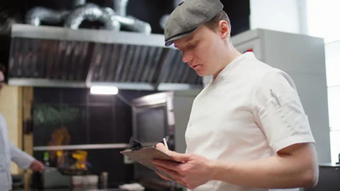 Chef Taking Notes while Working in Resta... | Stock Video | Pond5