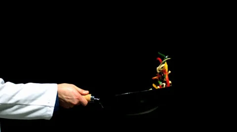 Chef tossing vegetables in a wok side vi... | Stock Video | Pond5