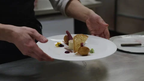 Chefs hands plating fancy desert in indu... | Stock Video | Pond5