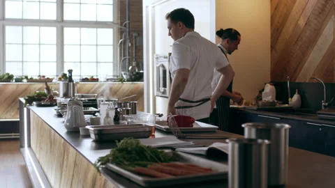 Chefs walking into kitchen to start cook... | Stock Video | Pond5