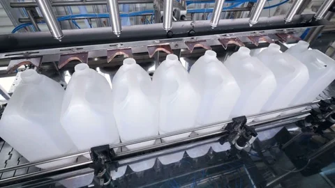 Chemical factory. Filling line of liquid... | Stock Video | Pond5