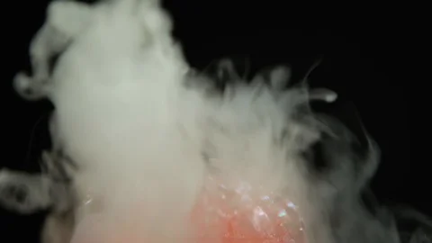Chemical reaction dry ice with red blood... | Stock Video | Pond5