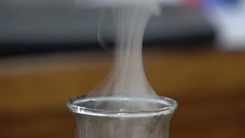 Chemical reaction with gas evolution in ... | Stock Video | Pond5