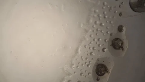 Chemical reaction under microscope | Stock Video | Pond5