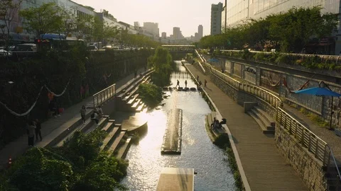 Cheonggyecheon stream walk at sunset top... | Stock Video | Pond5