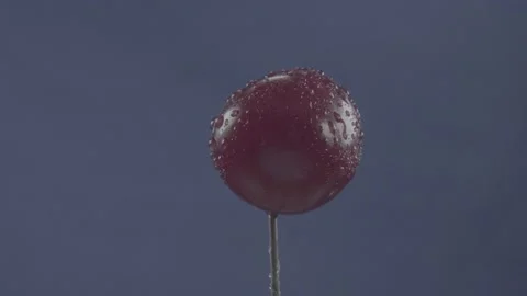 Cherry rotating with loop on blue screen... | Stock Video | Pond5
