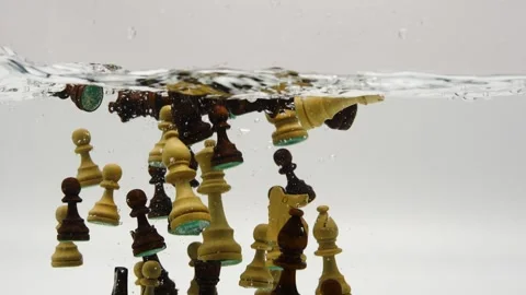 Chess pieces falling slow motion into th... | Stock Video | Pond5