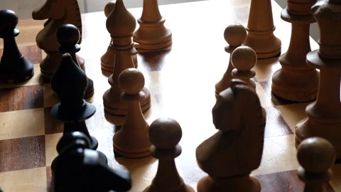 Chess pieces in a game position on a che... | Stock Video | Pond5