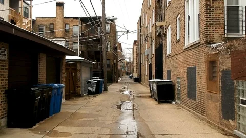 Chicago alleyway with trash cans, snow, ... | Stock Video | Pond5