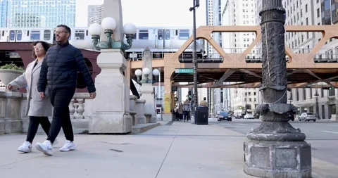 Chicago people walking with L in the bac... | Stock Video | Pond5