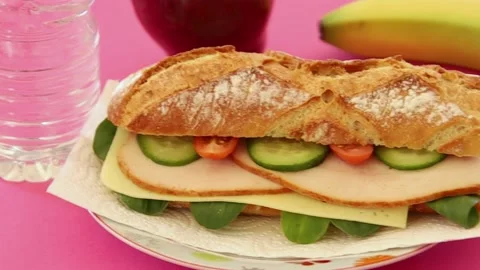 chicken breast sandwich with a banana an... | Stock Video | Pond5