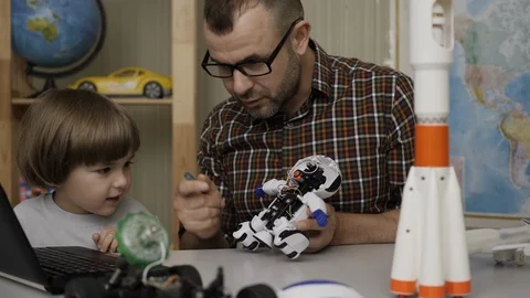 Child Boy And Teacher, Assembling Robots... | Stock Video | Pond5