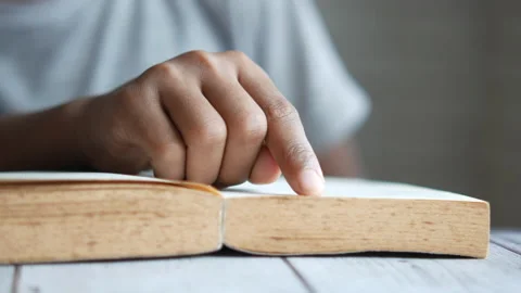 child boy hand reading a book on a table... | Stock Video | Pond5