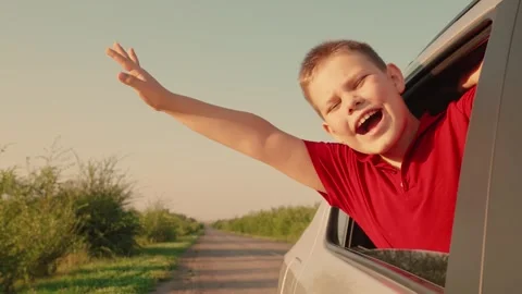 child boy looks out car window, joy face... | Stock Video | Pond5