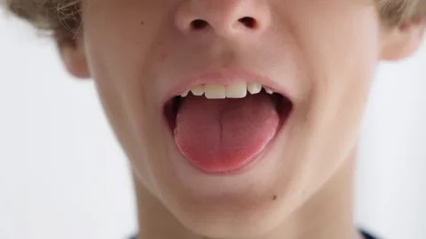 Child boy opens mouth wide. child shows ... | Stock Video | Pond5