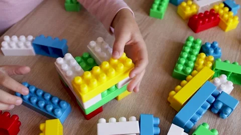 Child builds a tower with a constructor ... | Stock Video | Pond5