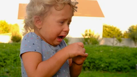A child is crying on the street. Selecti... | Stock Video | Pond5