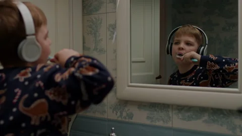 Child dancing brushing teeth. Blonde boy... | Stock Video | Pond5