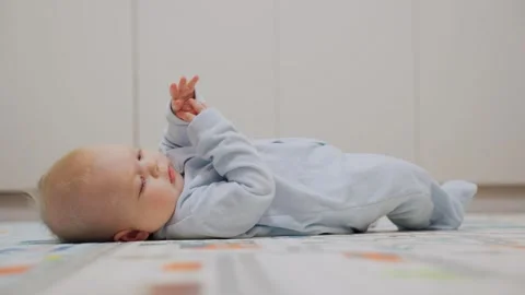 Child development, turning over before c... | Stock Video | Pond5