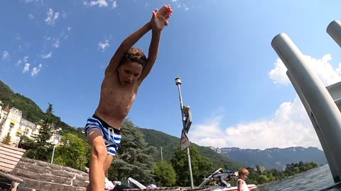 Child diving into lake water. Young boy ... | Stock Video | Pond5