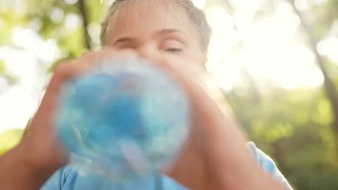 child drinking water from a lifestyle pl... | Stock Video | Pond5