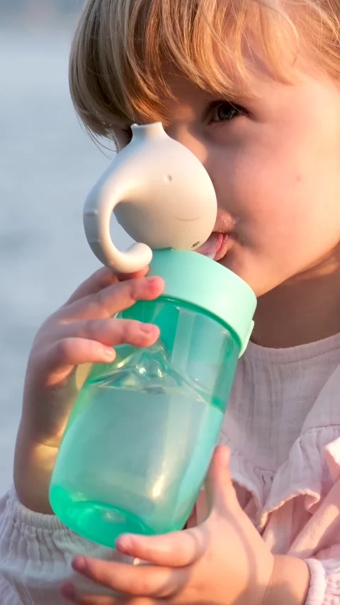 child drinking water from plastic bottle... | Stock Video | Pond5