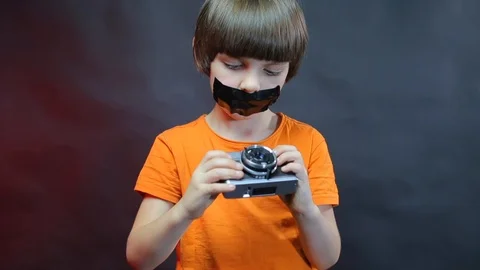 A child with a duct tape sealed with his... | Stock Video | Pond5