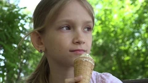 Child Eating Ice Cream at Playground, Gi... | Stock Video | Pond5