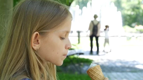 Child Eating Ice Cream at Playground, Gi... | Stock Video | Pond5