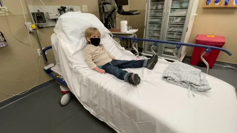 Child in Emergency Room Hospital Bed | Stock Video | Pond5