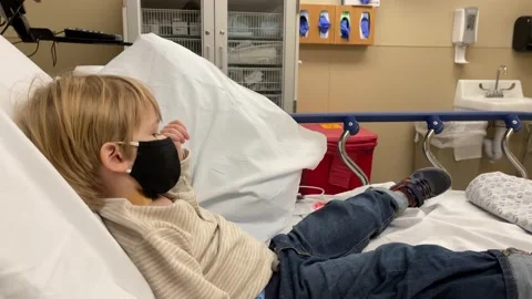 Child in Emergency Room Hospital Bed | Stock Video | Pond5