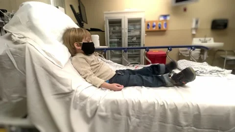 Child in Emergency Room Hospital Bed | Stock Video | Pond5