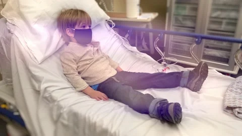 Child in Emergency Room Hospital Bed | Stock Video | Pond5