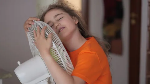 Child Enjoying Cool Wind From Electric F... | Stock Video | Pond5