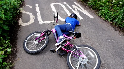 Child fallen off bike | Stock Video | Pond5