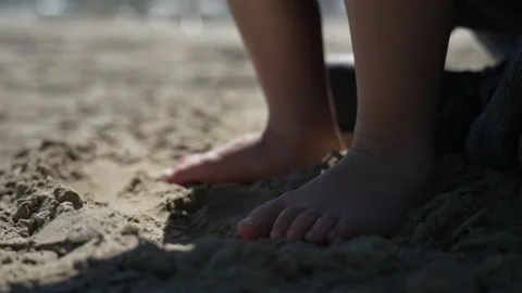 Child feet standing up at beach feeling ... | Stock Video | Pond5