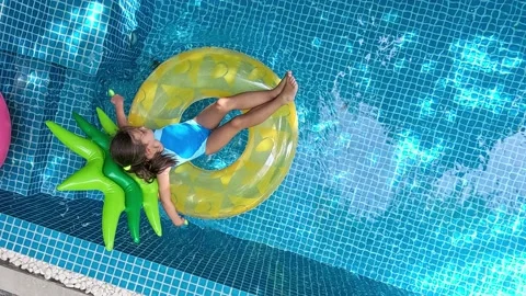 Child Fun In Blue Pool Water | Stock Video | Pond5