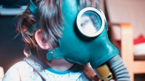 A child in a gas mask during the evacuat... | Stock Video | Pond5