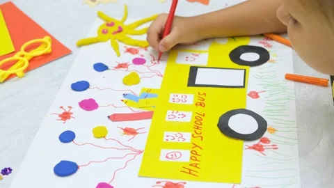 Child girl making school bus from paper ... | Stock Video | Pond5