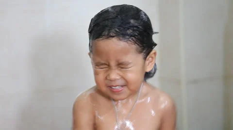 Child girl a shower with play water in b... | Stock Video | Pond5