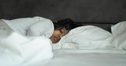 child girl sleeping on bed | Stock Video | Pond5