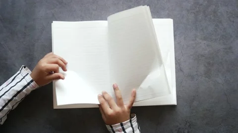 child hand turning a pager of a diary | Stock Video | Pond5