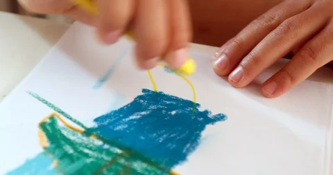 Child hands drawing on paper with crayon... | Stock Video | Pond5